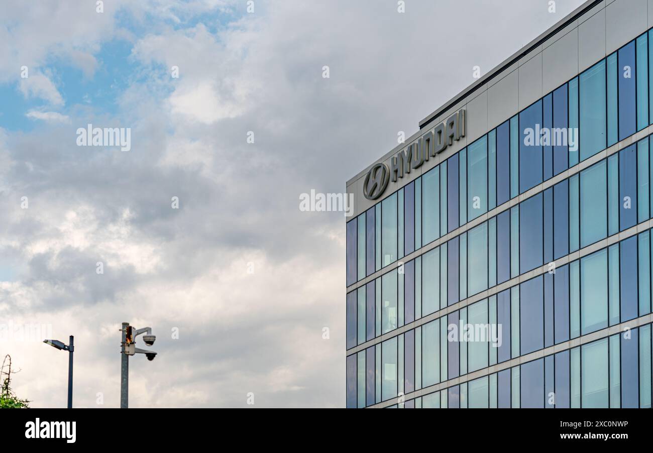 Modern office building with Hyundai logo and cloudy sky background in ...
