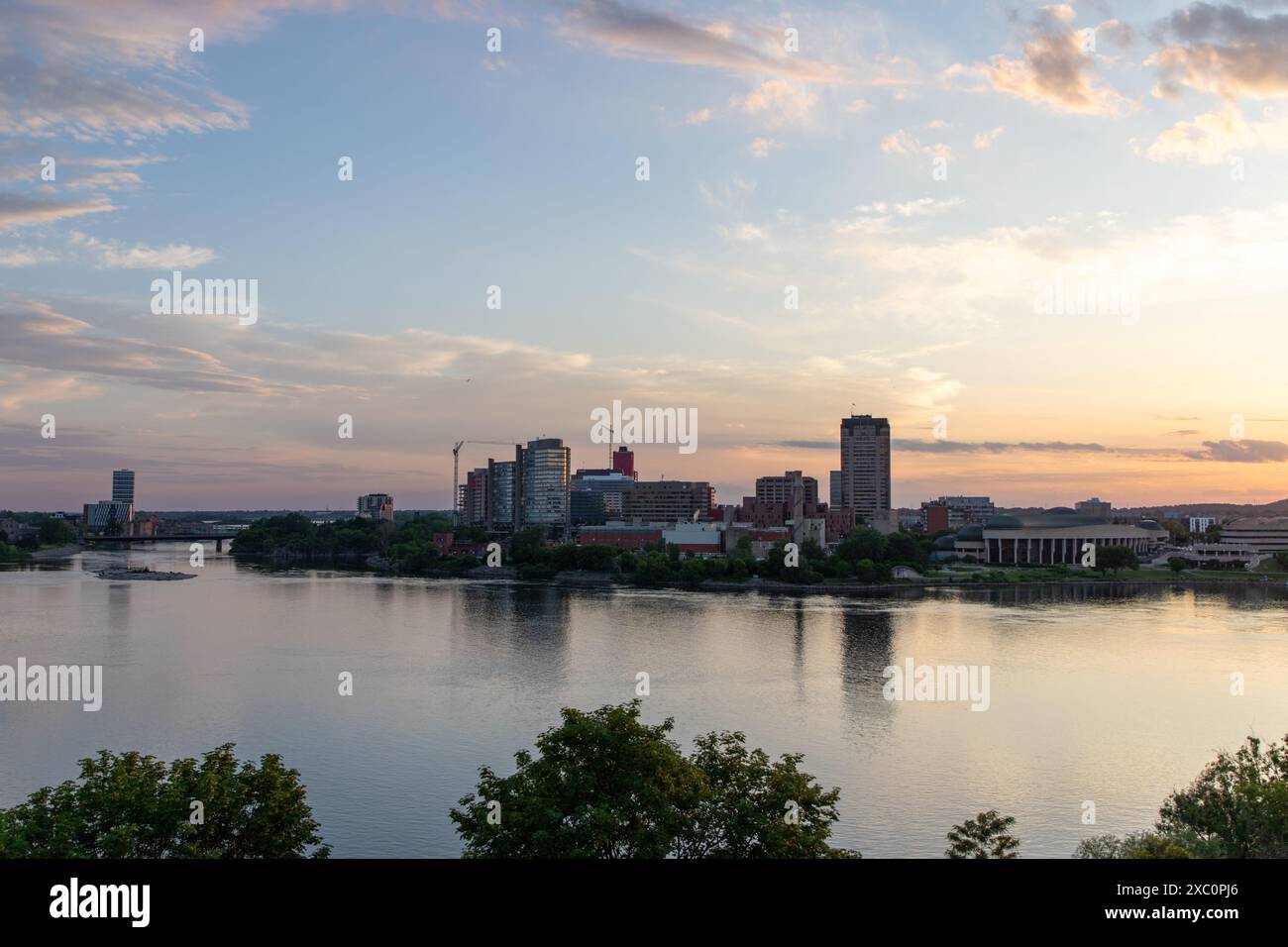 Ottawa, Canada - June 4, 2024: Ottawa River and Gatineau city of Quebec in Canada during sunset ...