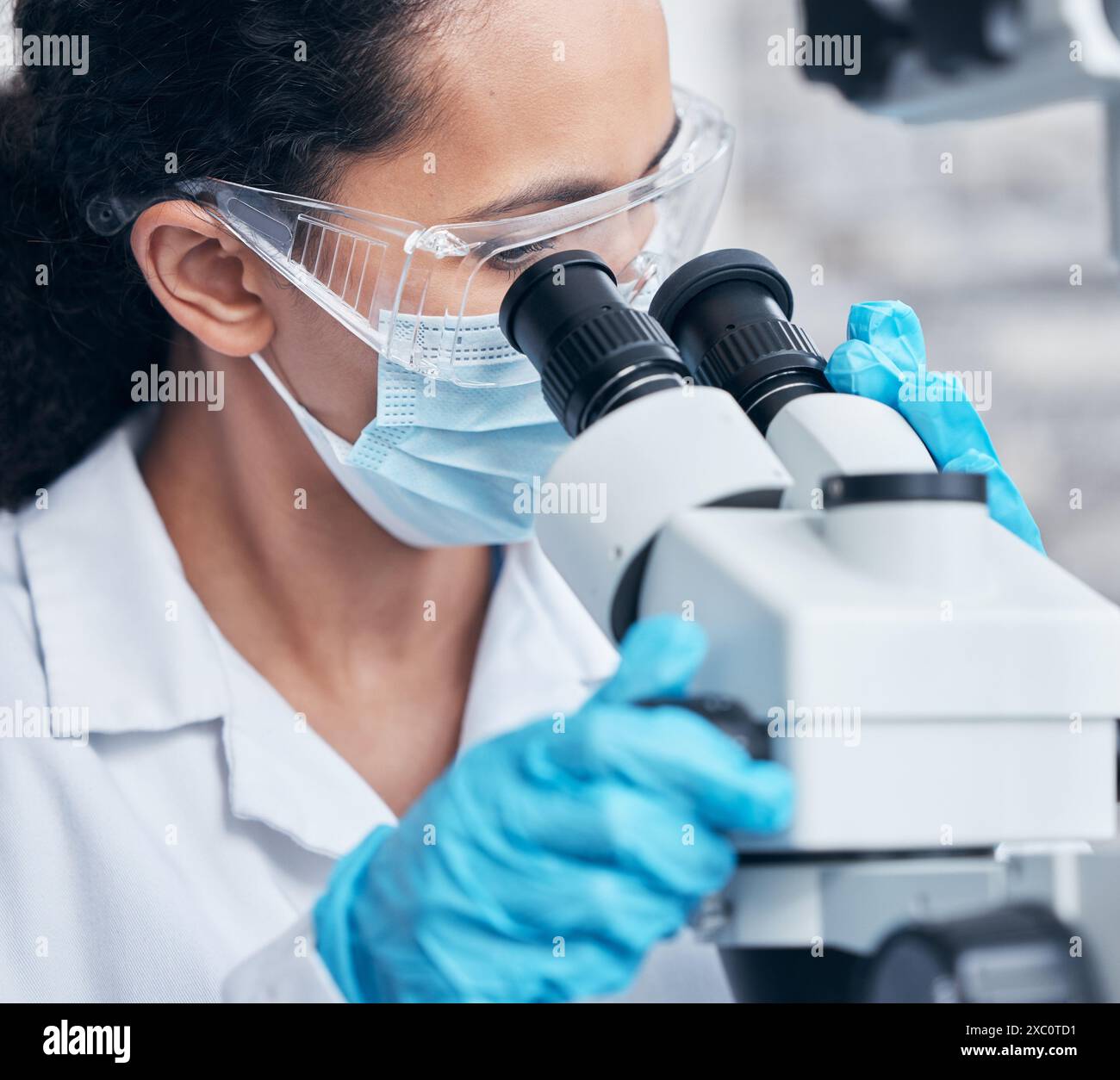 Woman, microscope and ppe in laboratory for innovation, research and ...