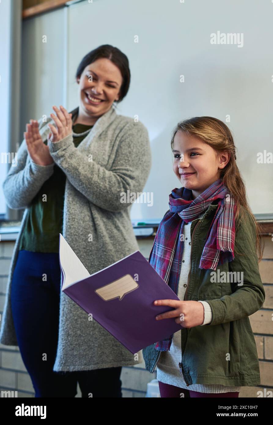 School, book and girl with teacher applause for classroom, presentation ...