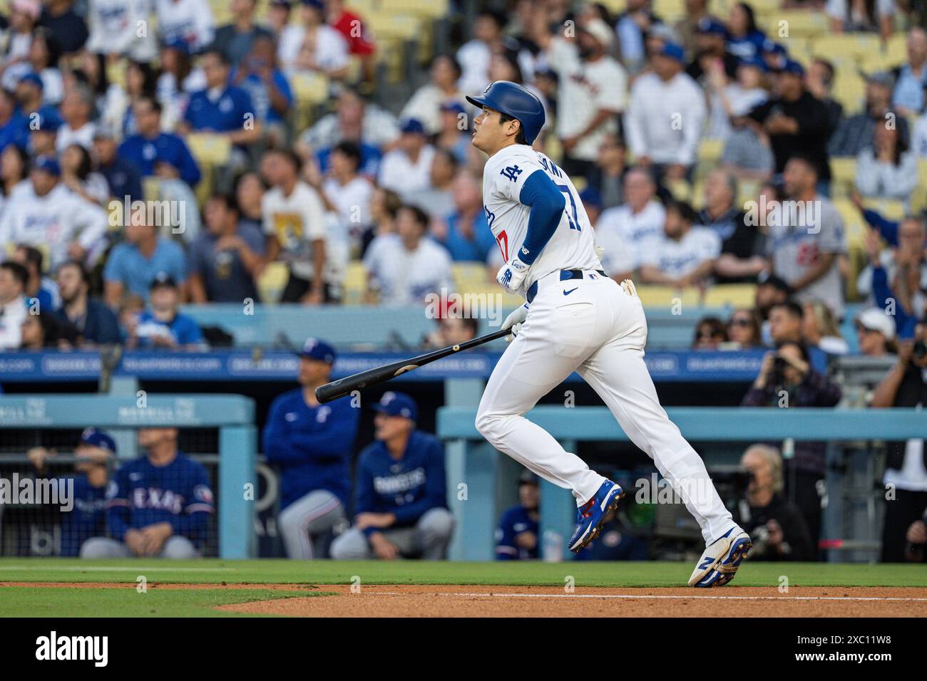 Los Angeles Dodgers designated hitter Shohei Ohtani (17) homers during a MLB game against the ...