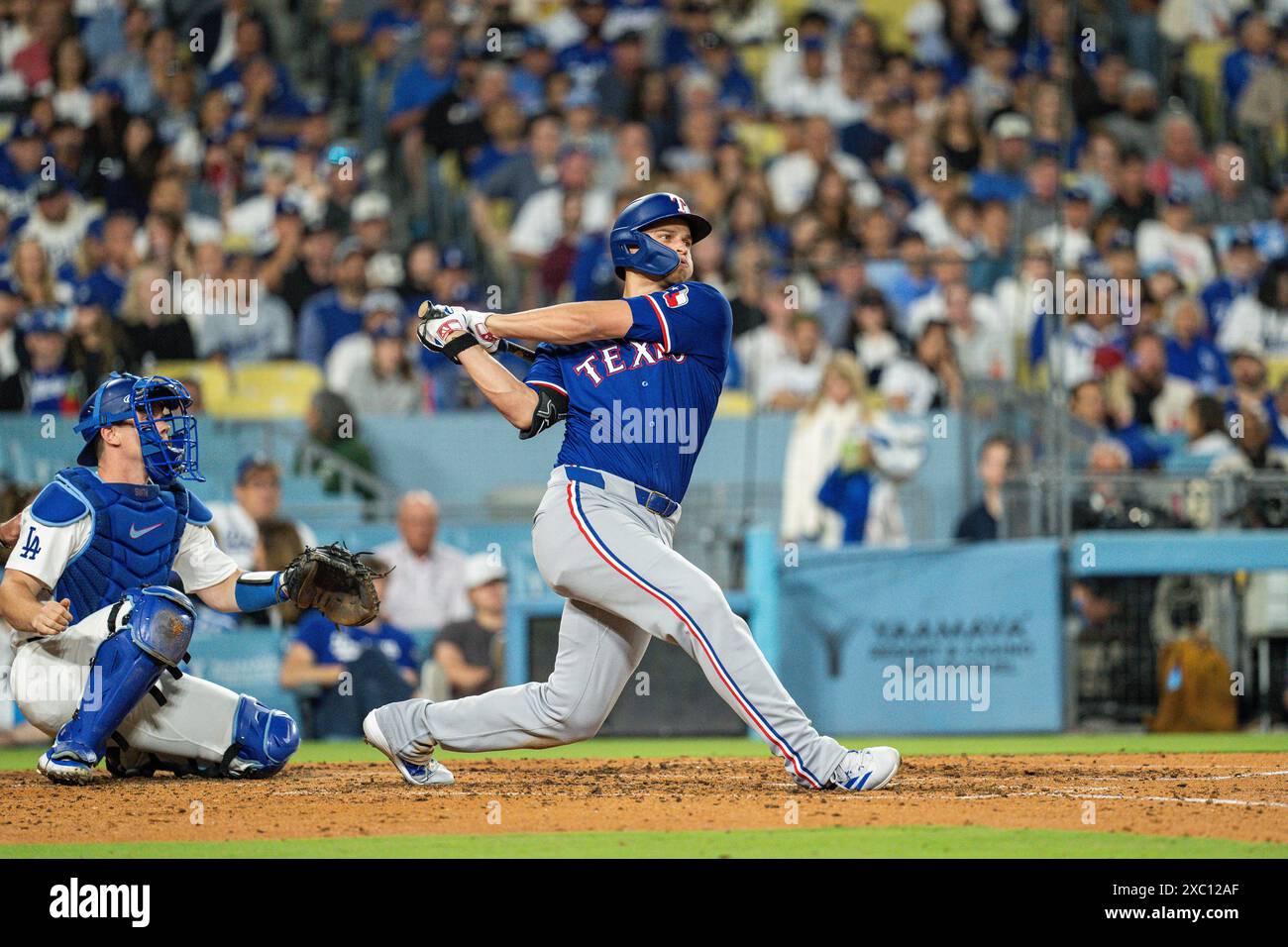 Texas Rangers shortstop Corey Seager (5) hits a three run homer during a MLB game against the ...