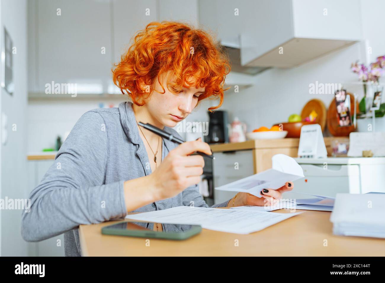 portrait attractive teenage girl filling out paper form Stock Photo - Alamy