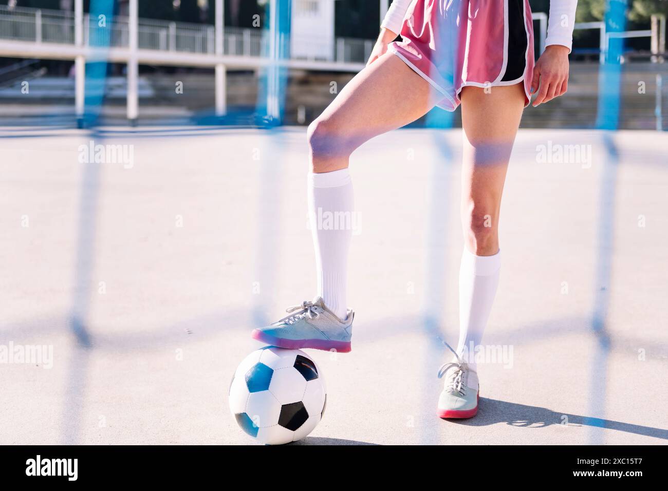 legs of a football player stepping a soccer ball Stock Photo - Alamy