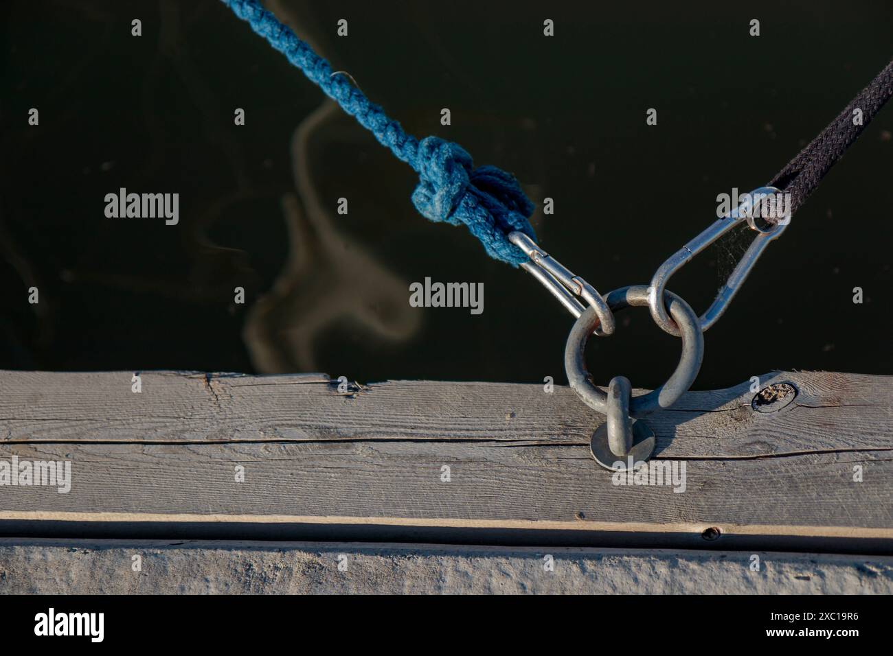Mooring ring for boats in the port with carbine and black rope from the ...
