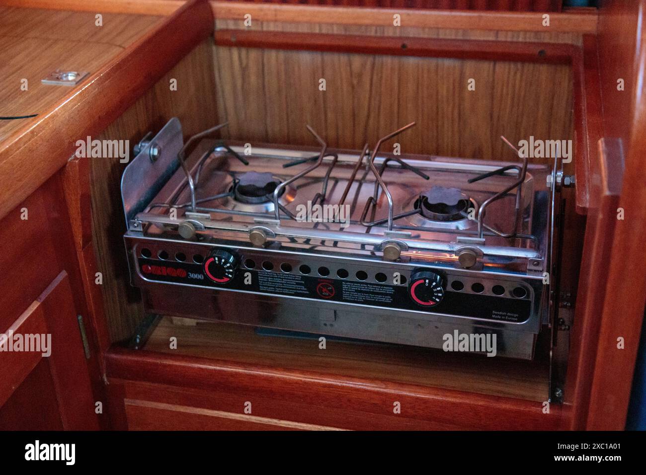 Cooking on the stainless stove on a sailing yacht in sailboat kitchen ...