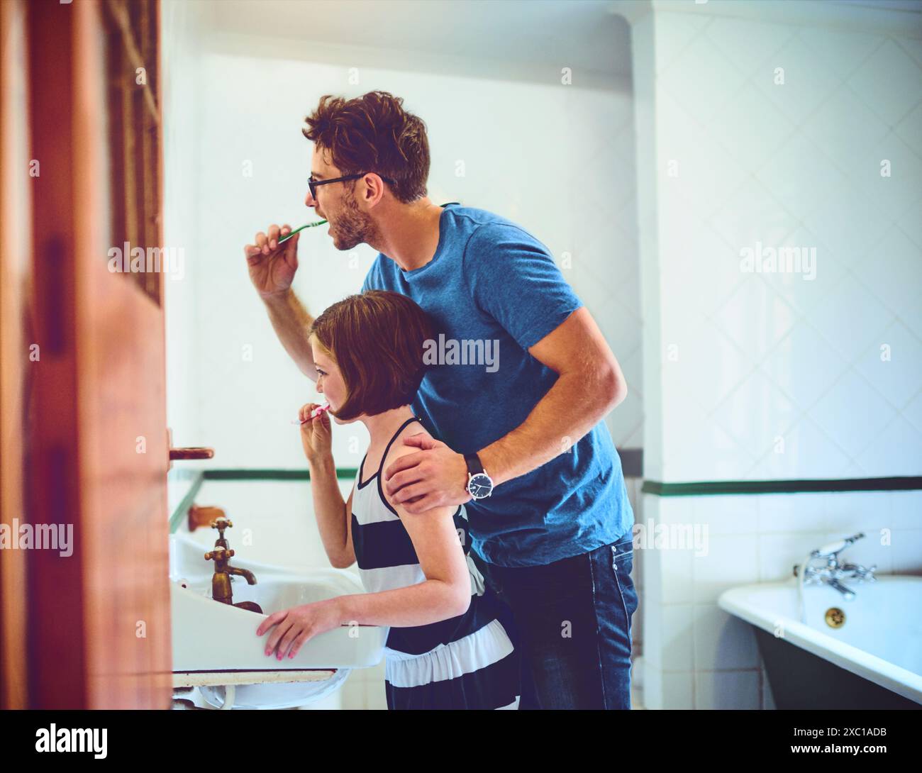 Oral health, teaching and father brushing teeth with kid for wellness ...