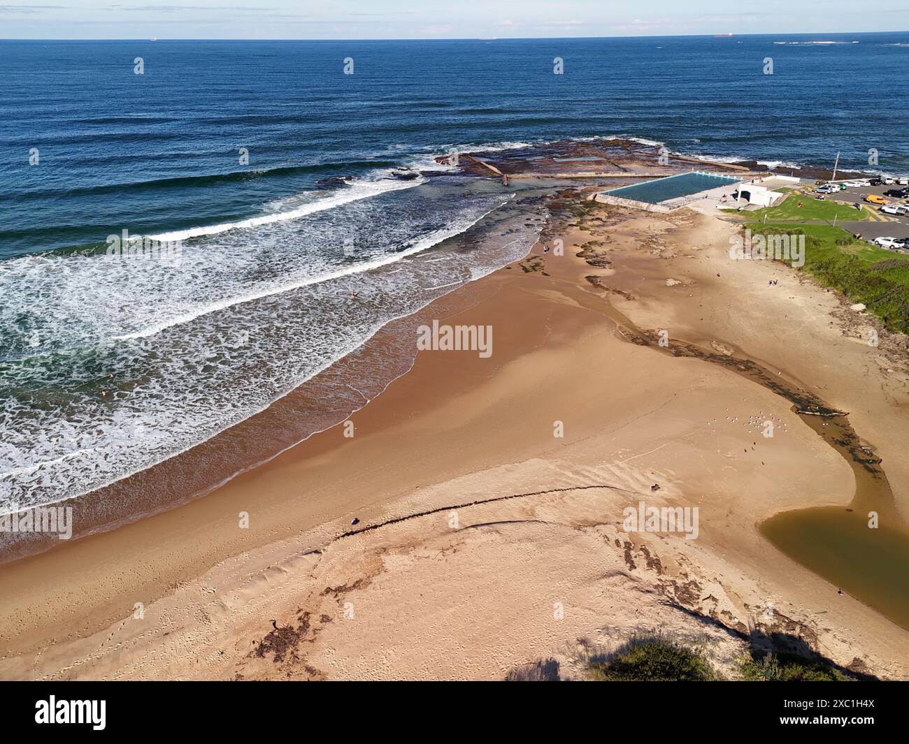 An aerial view of a coastal rock pool and beach in Austinmer, New South ...