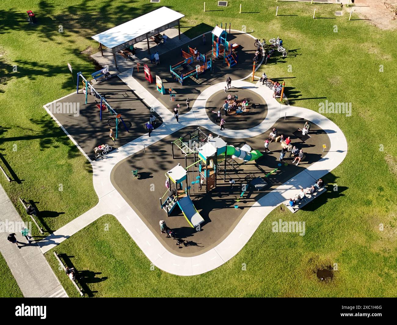 An aerial view of a busy playground with children and parents enjoying ...