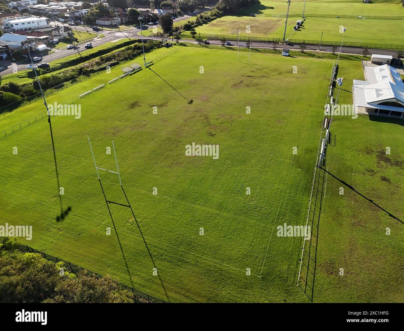 Aerial view of an empty rugby field with goal posts and surrounding ...