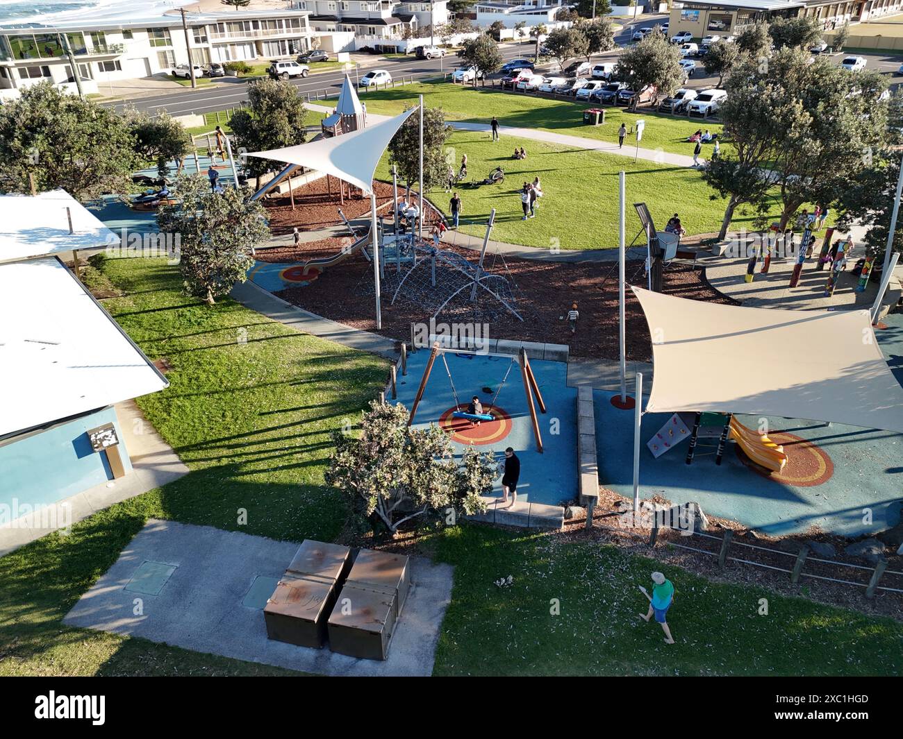 Aerial view of a vibrant playground with children playing and adults ...