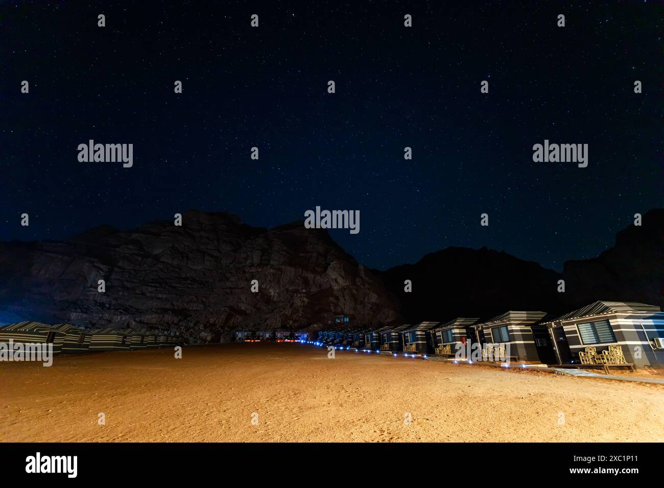 Tranquil night sky filled with stars above the unique Jabal al qattar ...