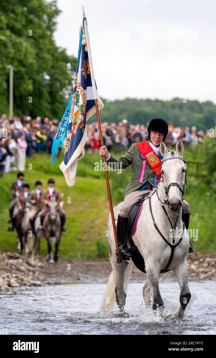 Standard Bearer Mathew Stanners leads over 200 riders across the River ...