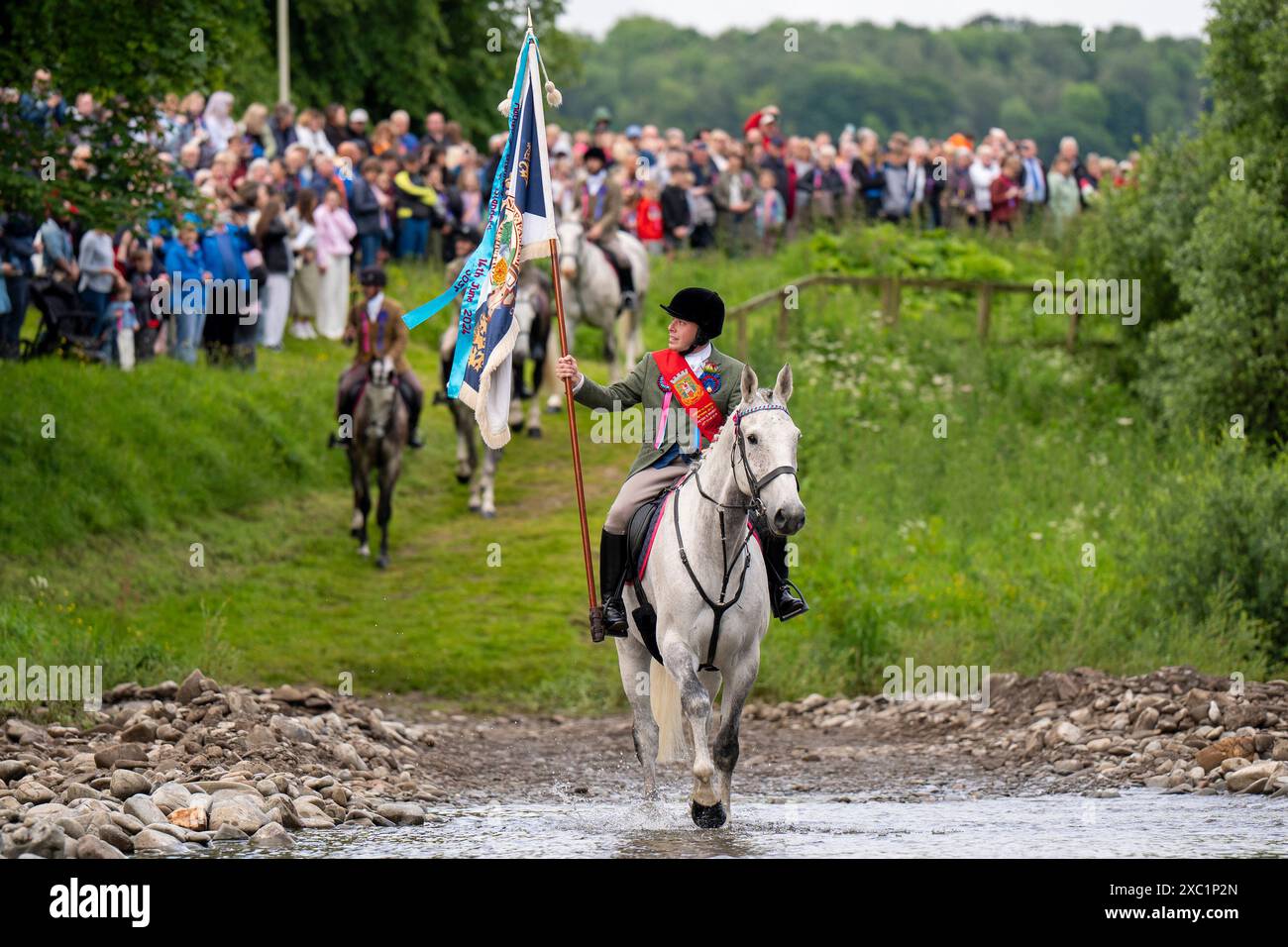 Standard Bearer Mathew Stanners leads over 200 riders across the River ...