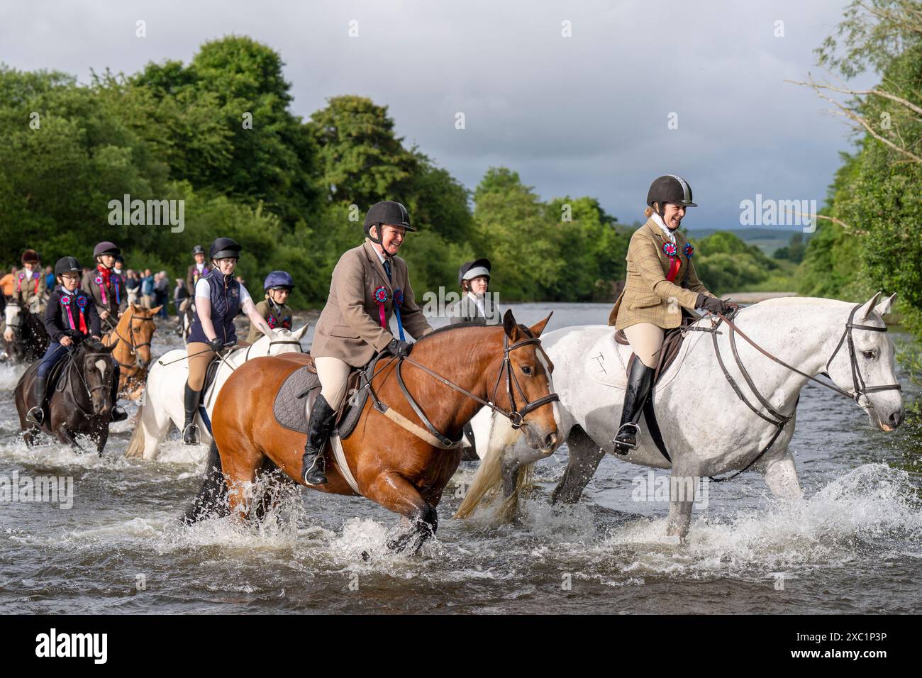 Riders ford the River Ettrick during the Selkirk Common Riding, a ...