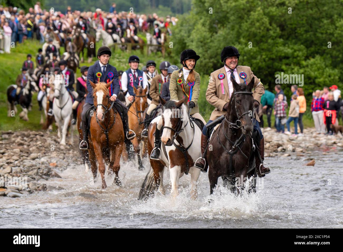 Riders ford the River Ettrick during the Selkirk Common Riding, a ...
