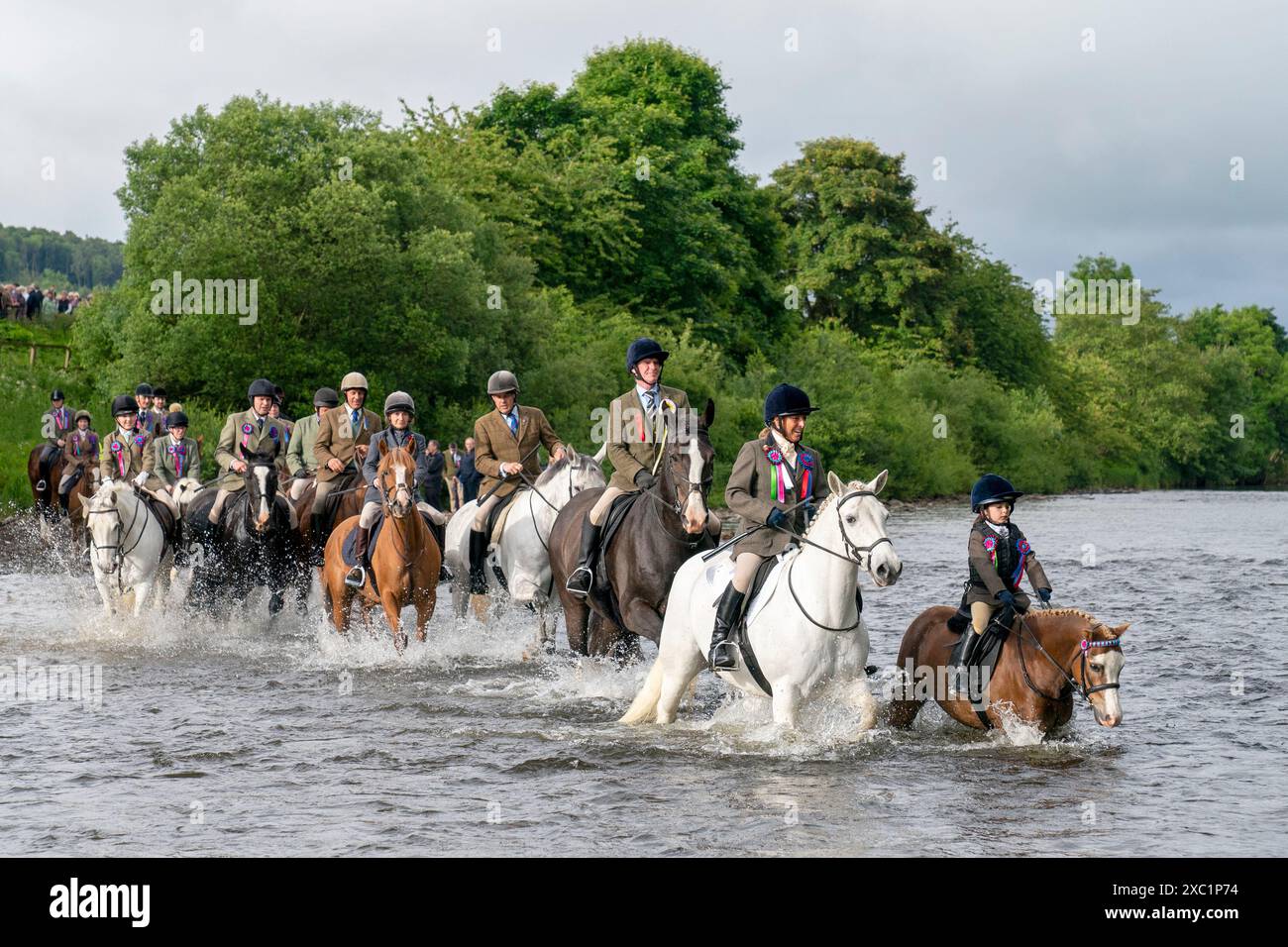 Riders ford the River Ettrick during the Selkirk Common Riding, a ...