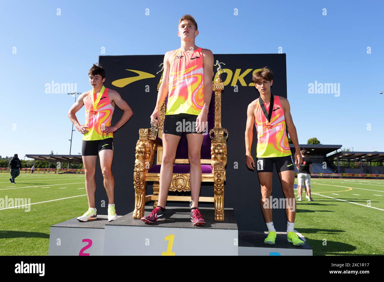 Boys 800m winner Cooper Lutkenhaus (center) poses with runner-up ...
