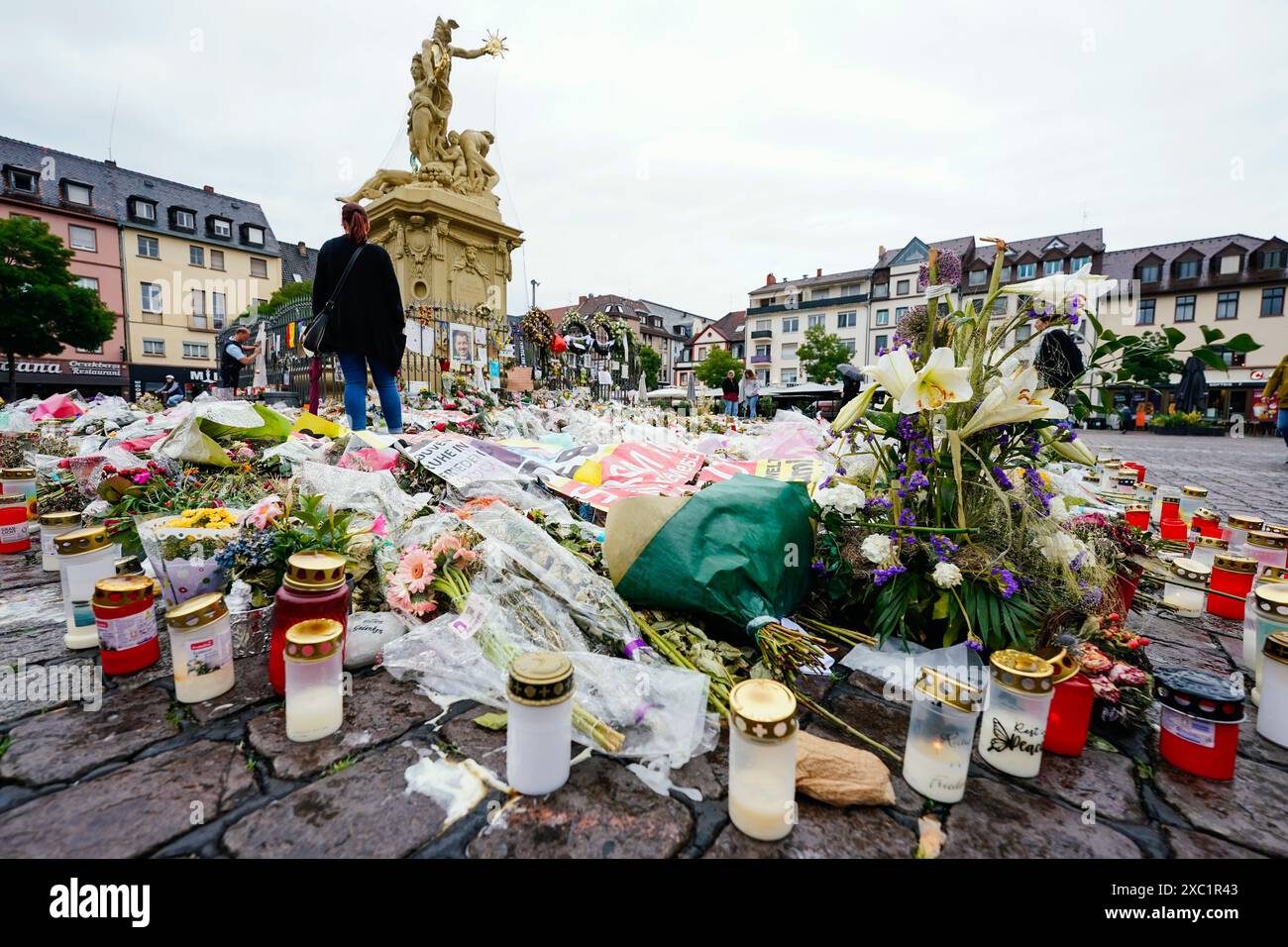 Mannheim, Germany. 14th June, 2024. A woman stands on Maktplatz at the ...