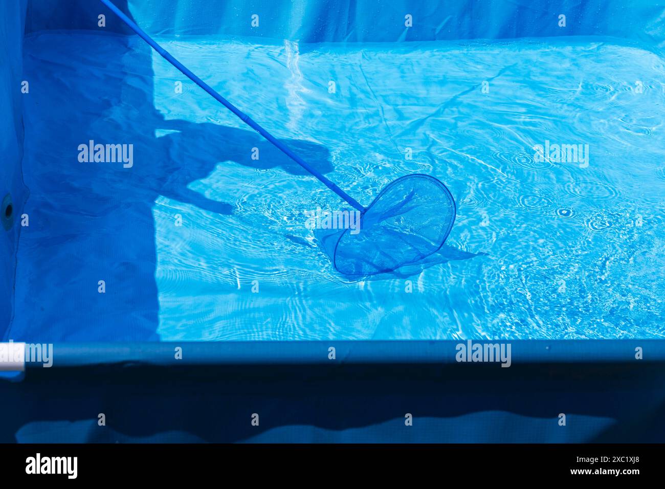 bright blue pool being cleaned, highlighting the tranquility and beauty ...