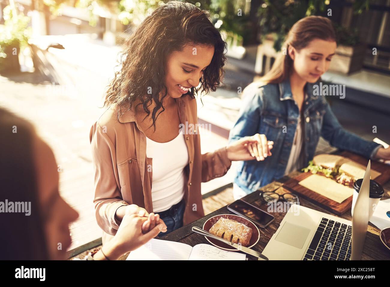 Women, praying and holding hands in restaurant with connection for ...