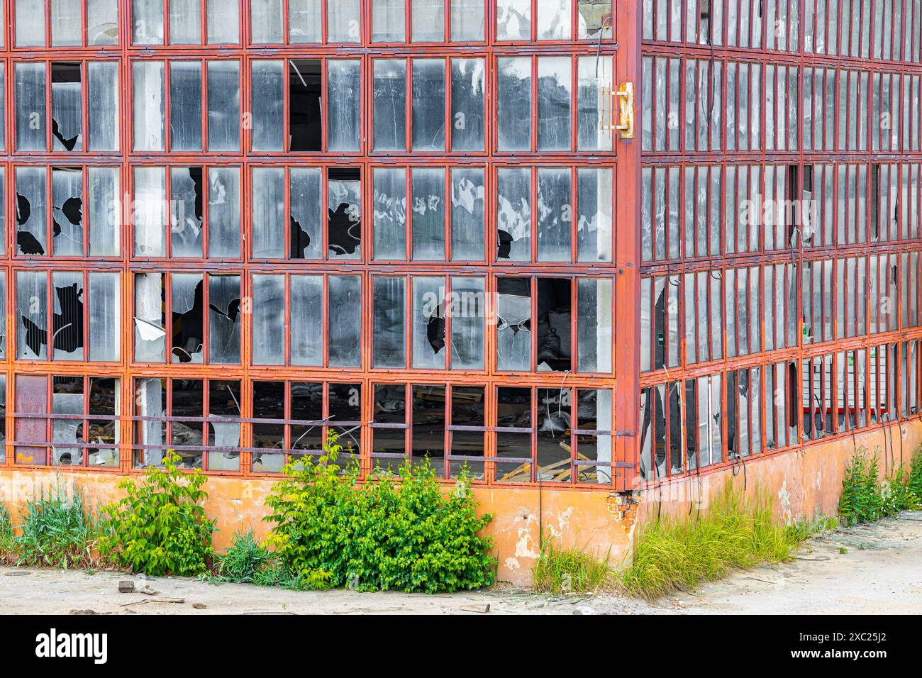 abandoned building with broken glass, close-up. abandoned factory floor ...