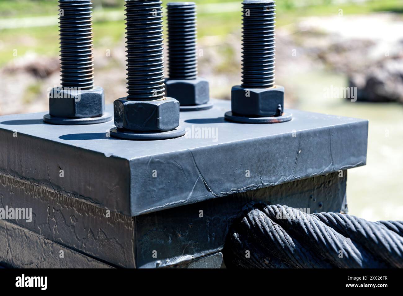 Bridge steel system of fasteners with big bolts and screws and chains ...