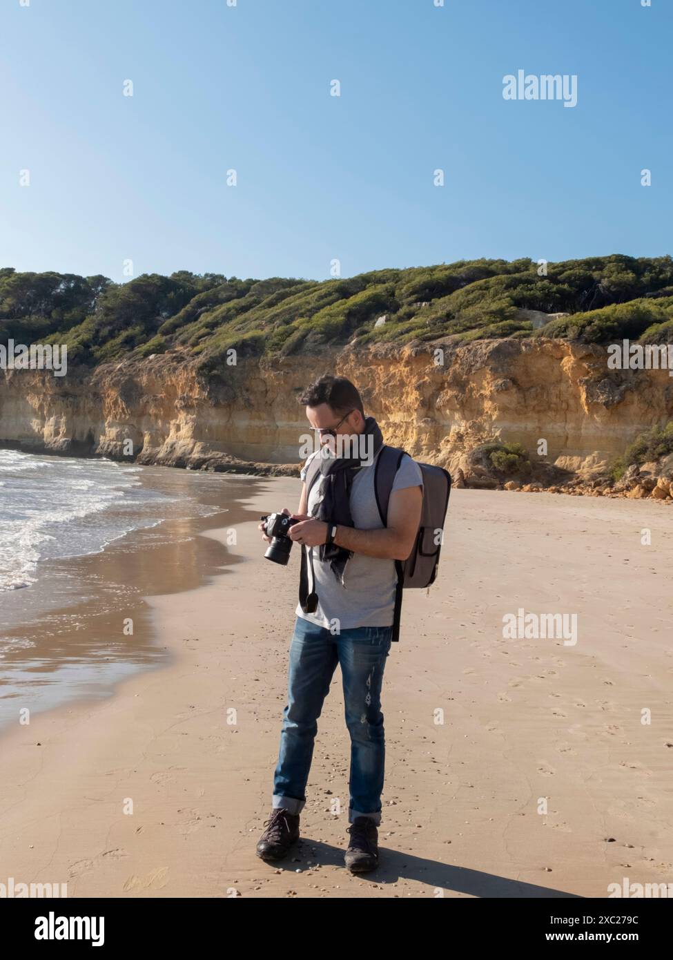 Professional photographer taking photos of beautiful sea scenery Stock ...