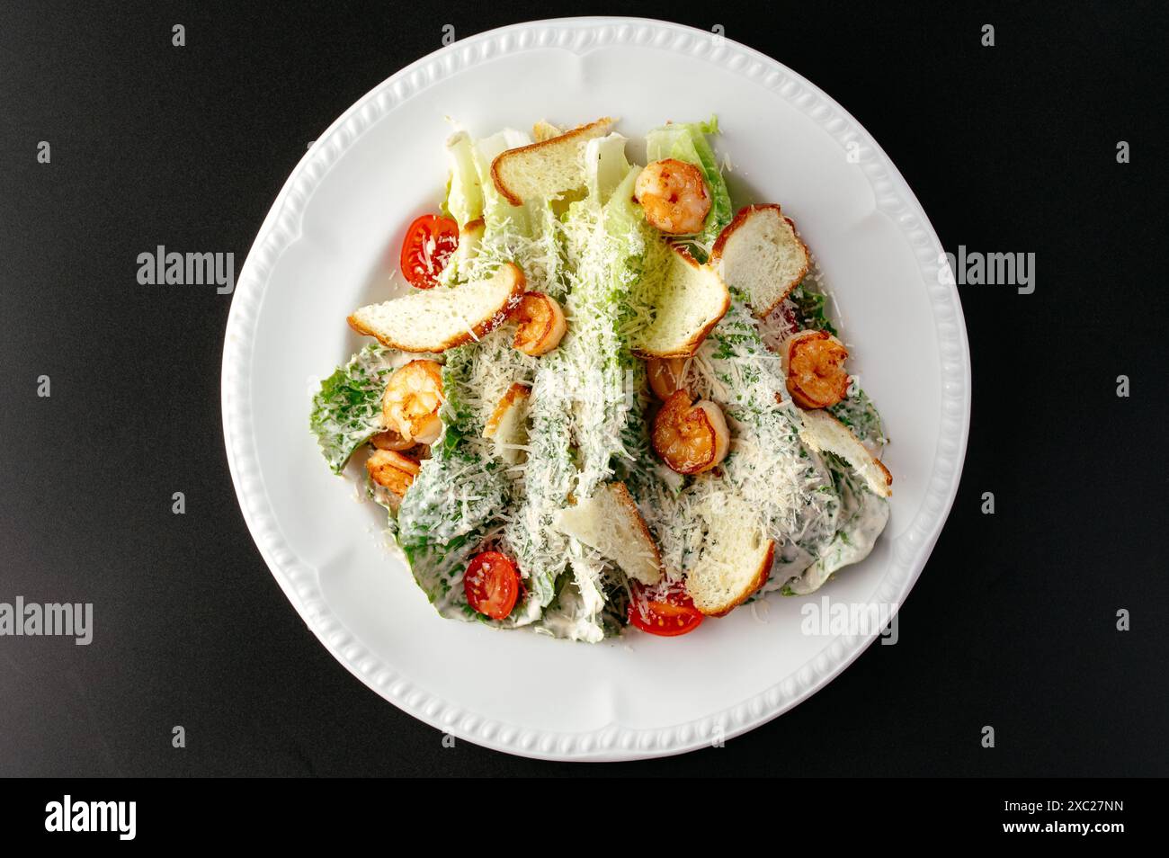 Caesar salad with shrimp and sauce. restaurant menu Stock Photo - Alamy