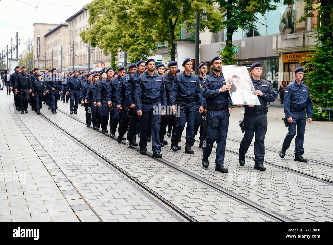 Mannheim, Germany. 14th June, 2024. Police officers walk through the ...