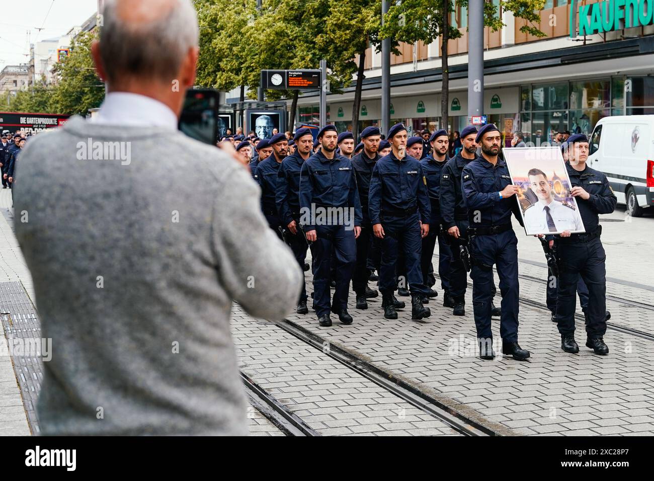 Mannheim, Germany. 14th June, 2024. Police officers walk through the ...