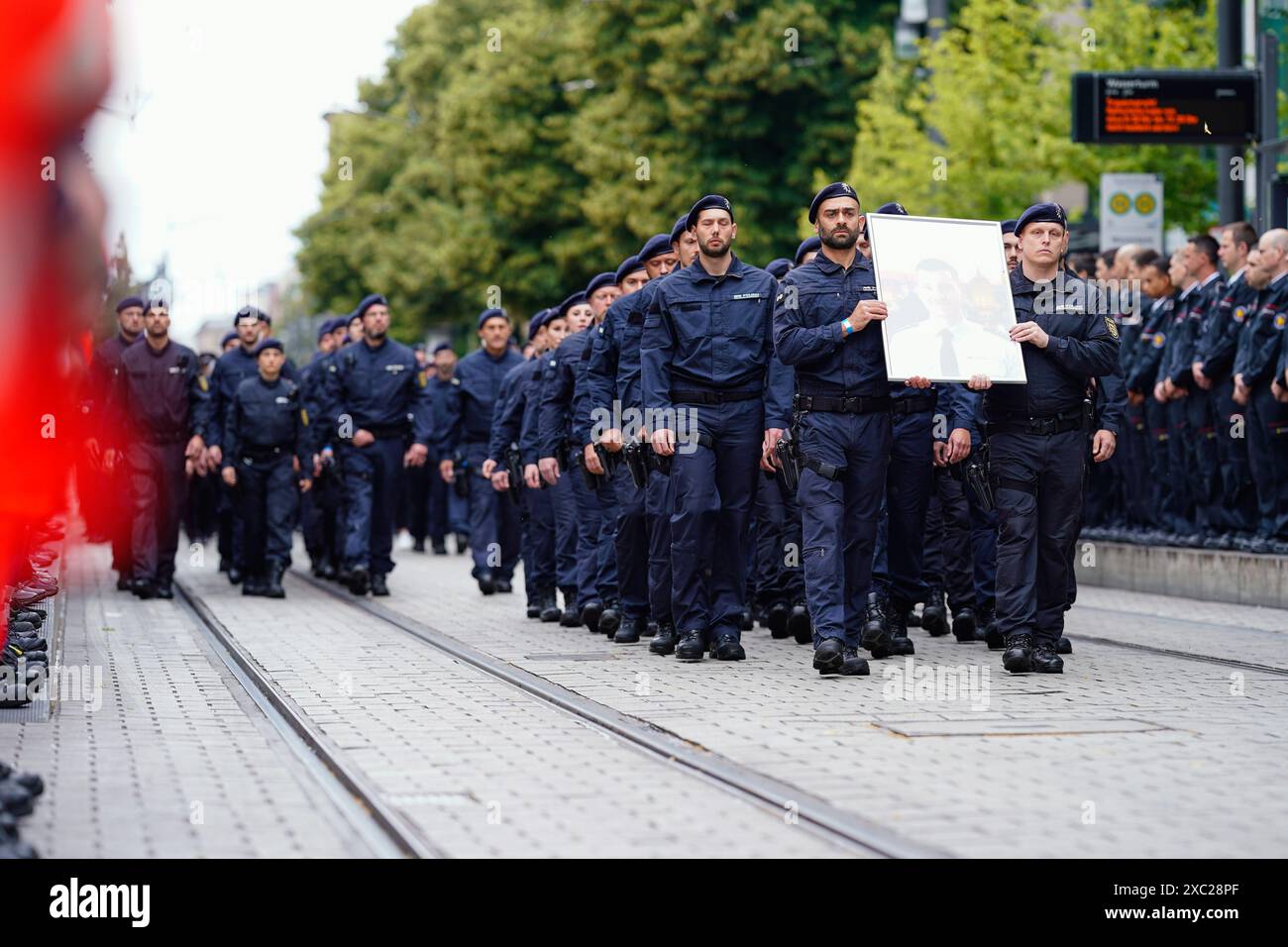 Mannheim, Germany. 14th June, 2024. Police officers walk through the ...