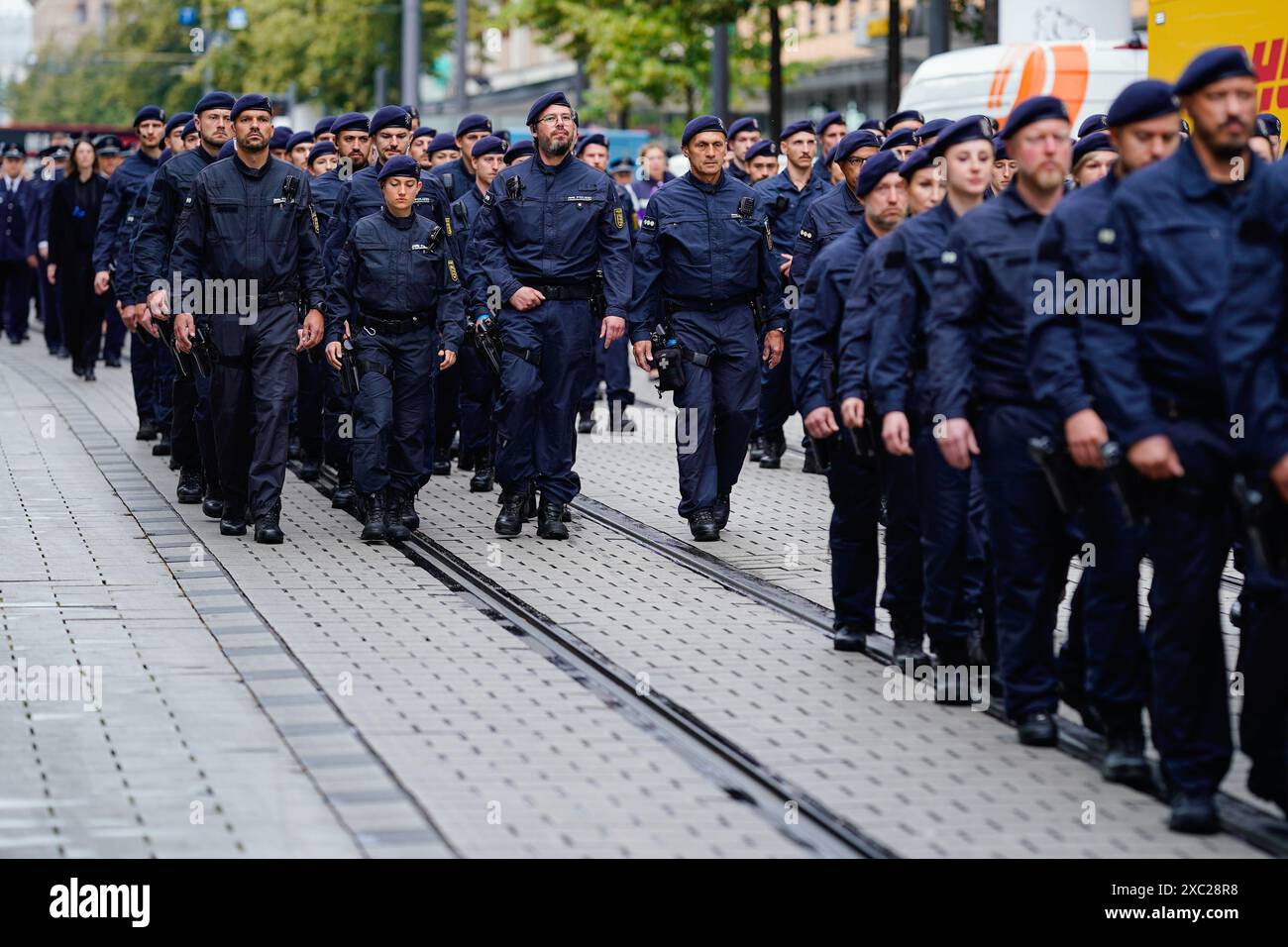 Mannheim, Germany. 14th June, 2024. Police officers walk through the ...