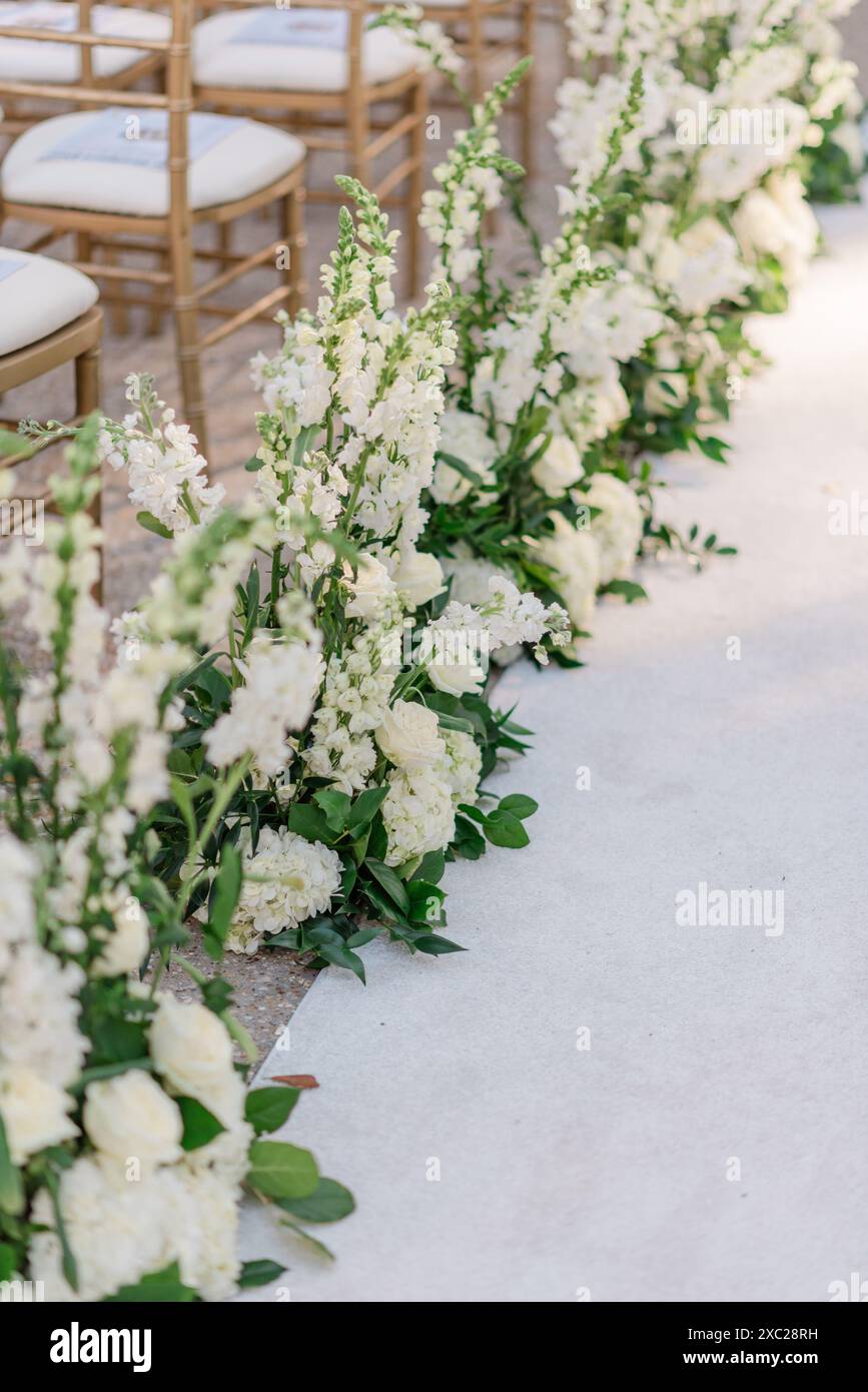 White floral design as aisle runner at wedding Stock Photo - Alamy