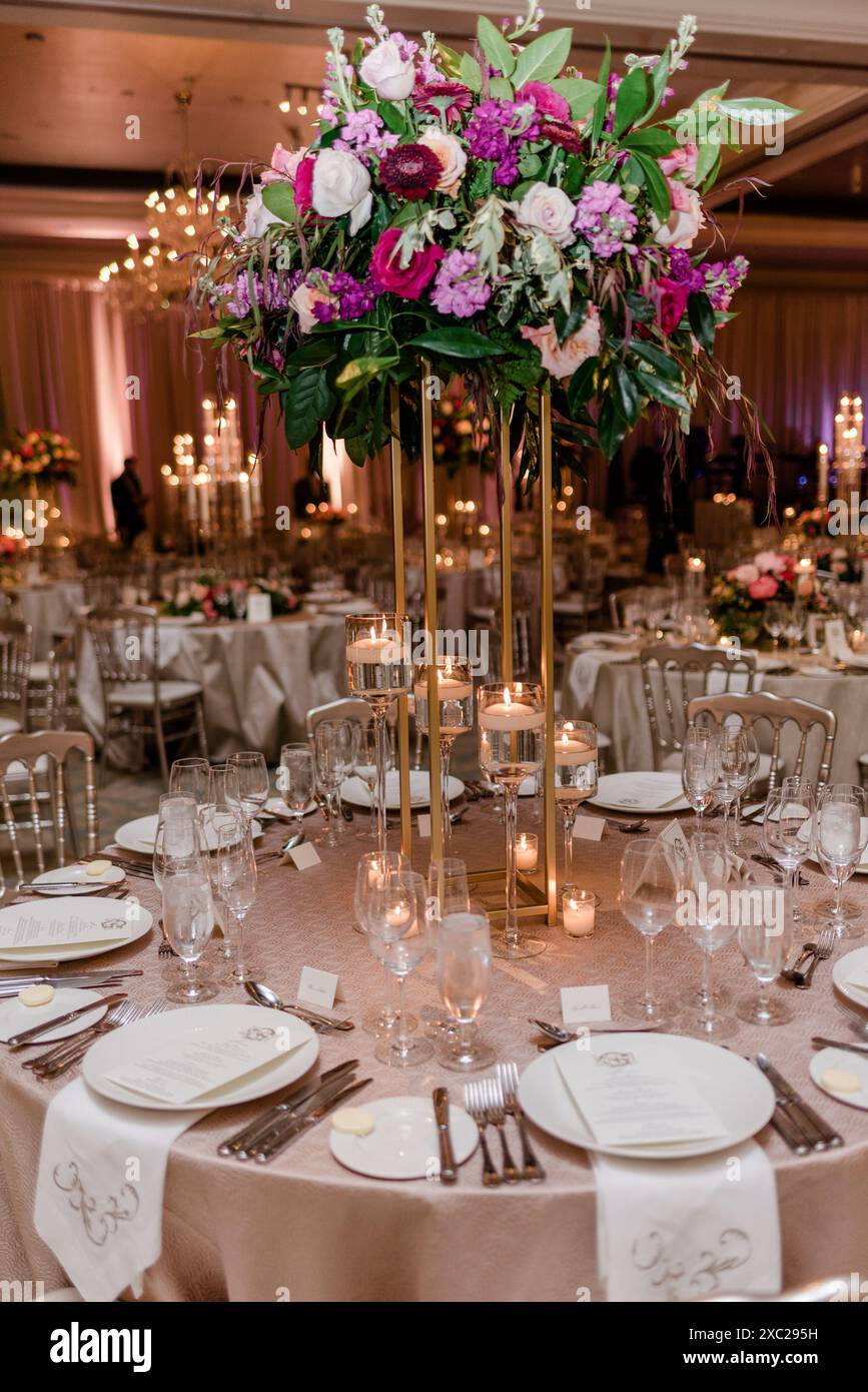 Elevated floral arrangement at candlelit wedding reception Stock Photo ...