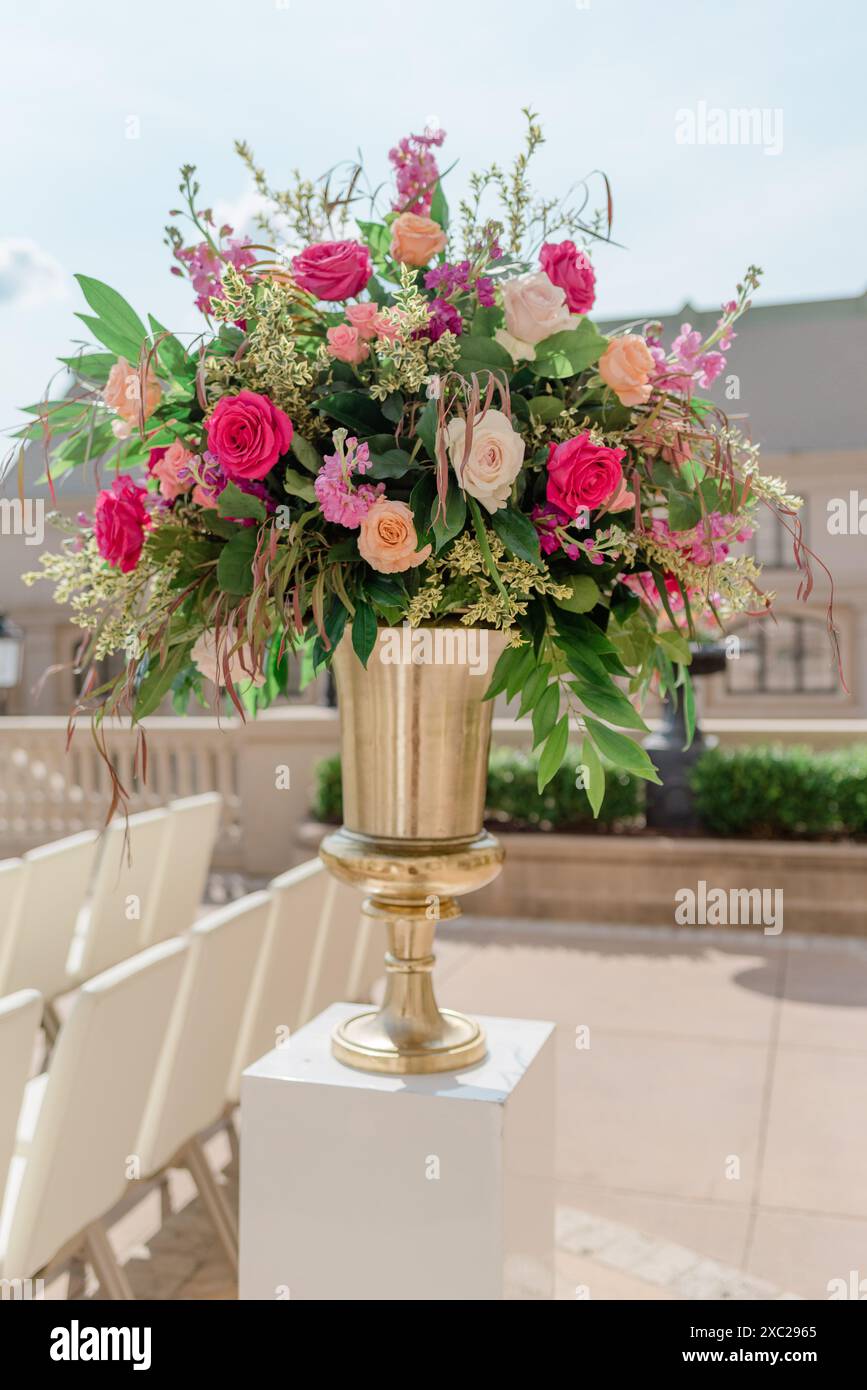 Bright colorful wedding florals for outdoor ceremony Stock Photo - Alamy