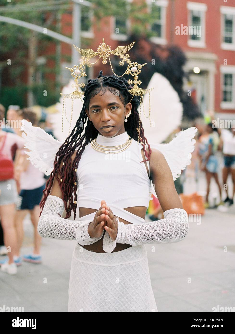 young adult in angel costume poses for photo during nyc pride Stock ...
