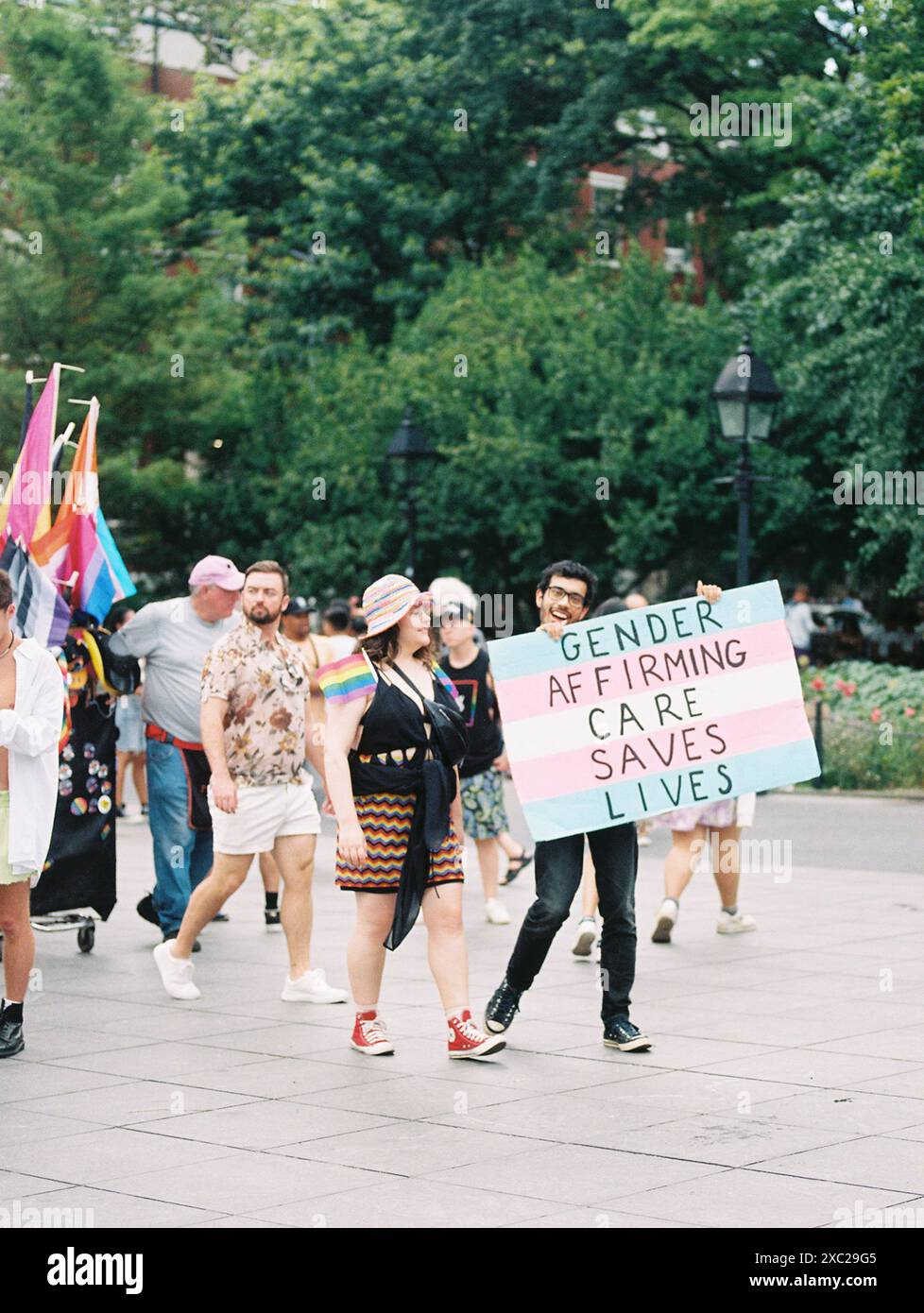 person holding gender affirming care saves lives sign during nyc pride ...