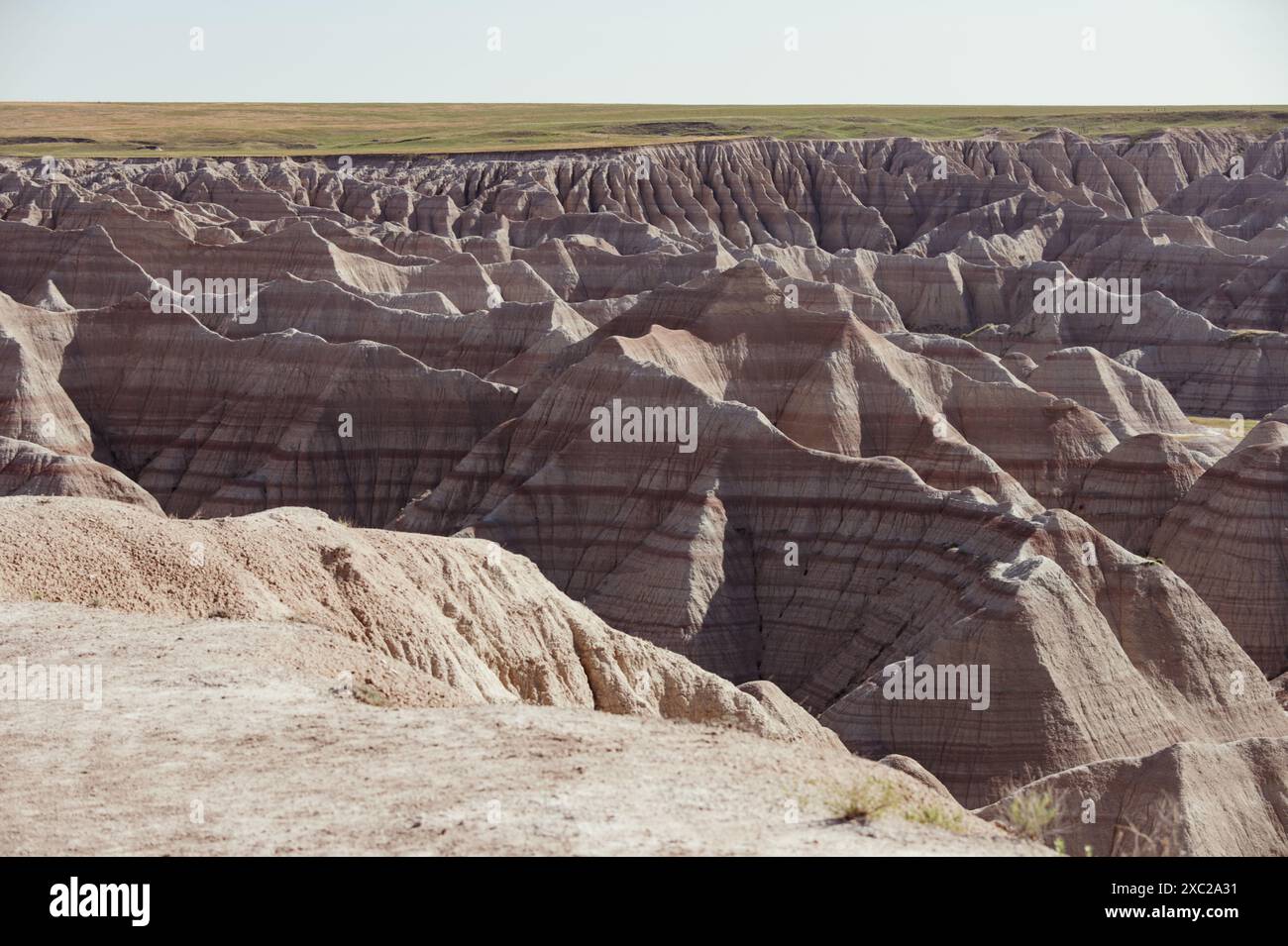 Rock formations of Badlands National Park with clear sky in summer ...