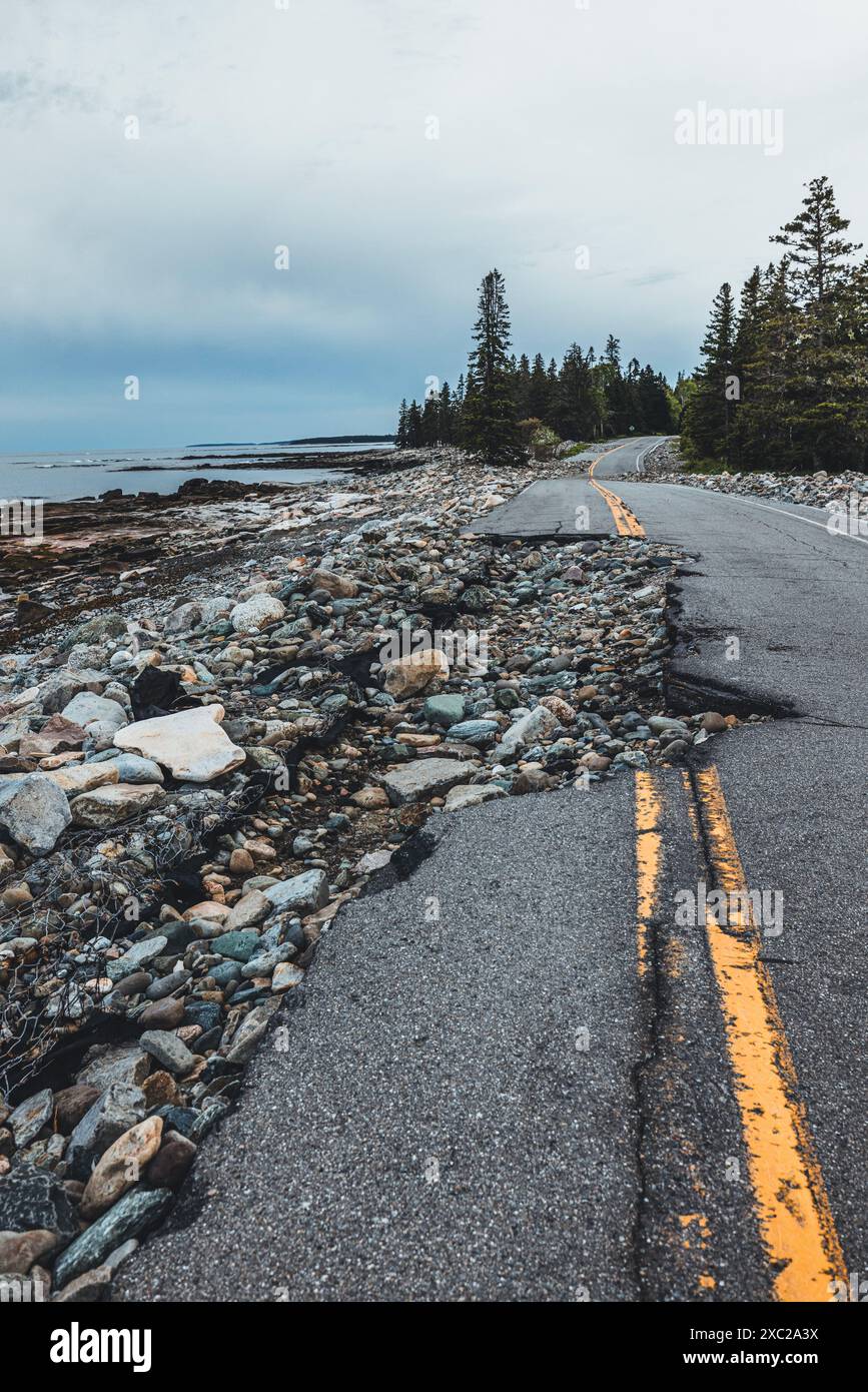 Washed out closed and damaged road from storm caused by climate change ...