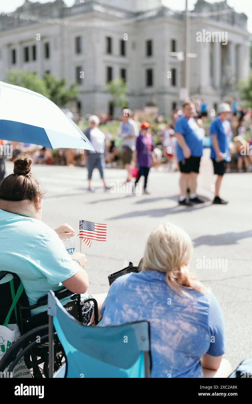 spectators watching 4th of July parade Stock Photo - Alamy
