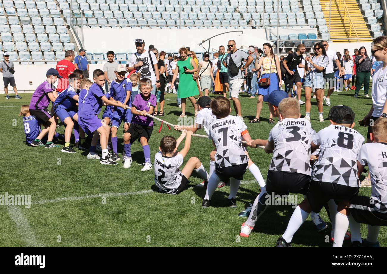 ODESSA, UKRAINE, June 9, 2024: Children's teams play tug of war at ...