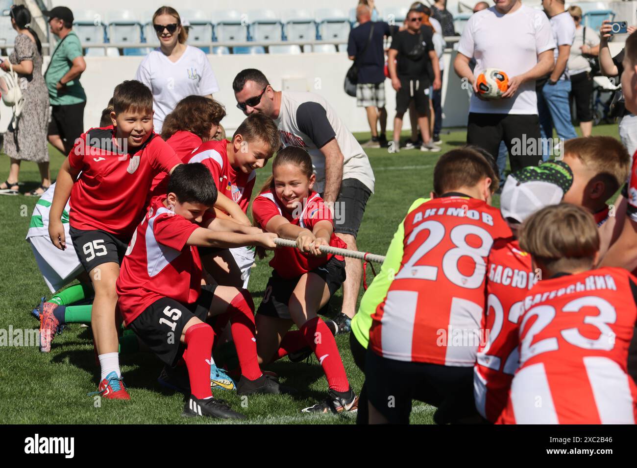 ODESSA, UKRAINE, June 9, 2024: Children's teams play tug of war at ...