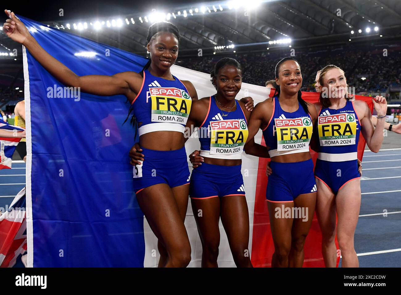 Athletes of team France celebrate after competing in the 4x100m women ...