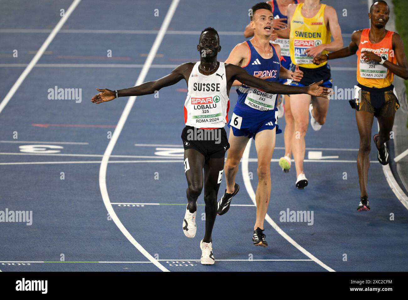 Dominic Lokinyomo Lobalu of Switzerland celebrates after competing in ...