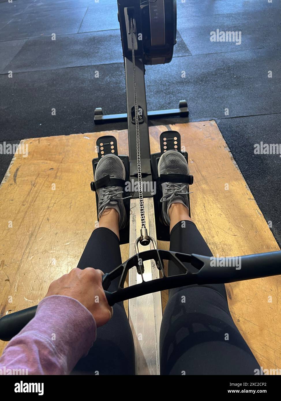 Person using a rowing machine in a gym, view from above Stock Photo - Alamy