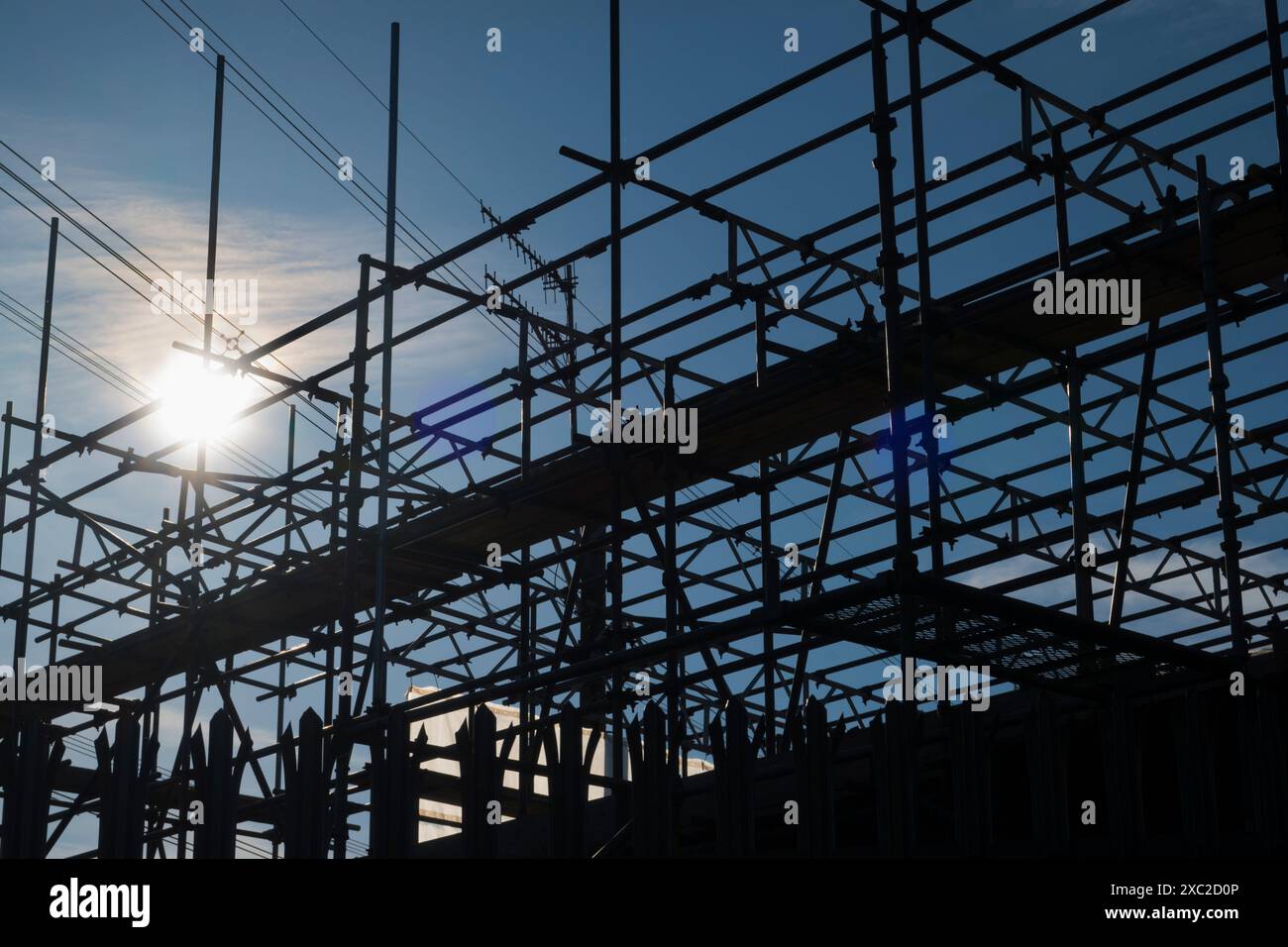Scaffolding and tarpaulins - at a construction site for a new factory ...