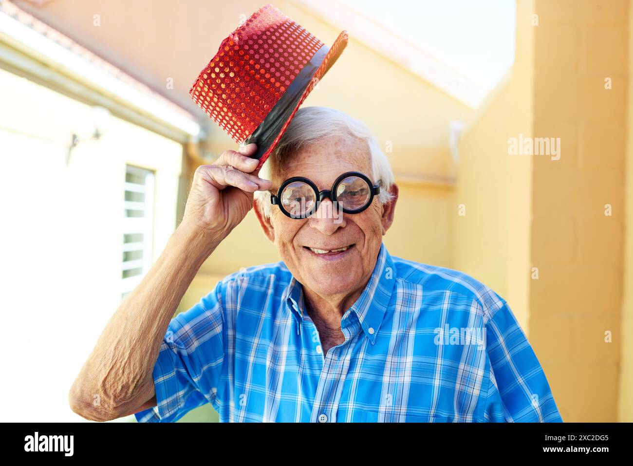 Face, smile and glasses with senior man in hallway of retirement home ...