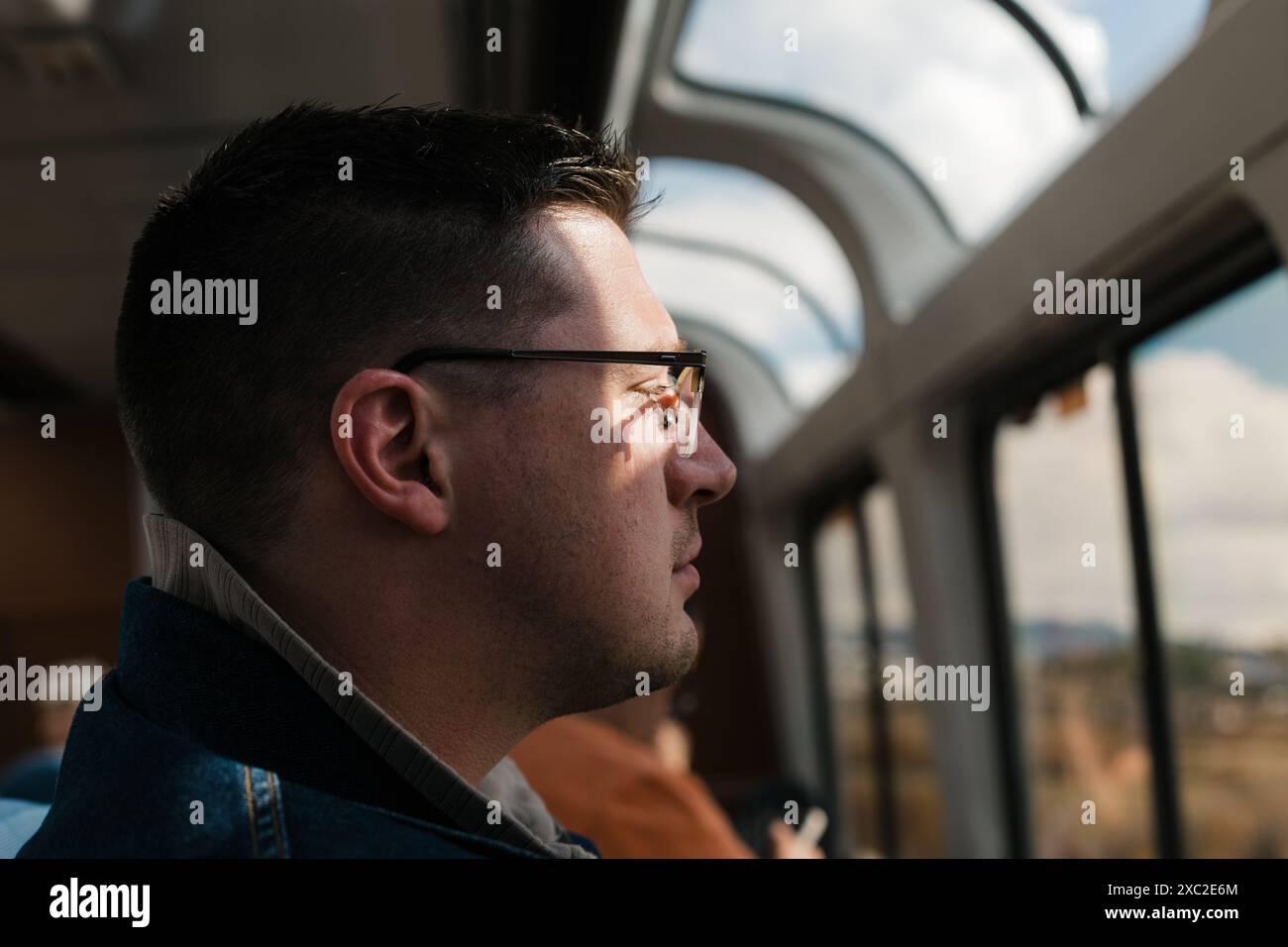 Man Riding the Zephyr Train Through Colorado Stock Photo - Alamy