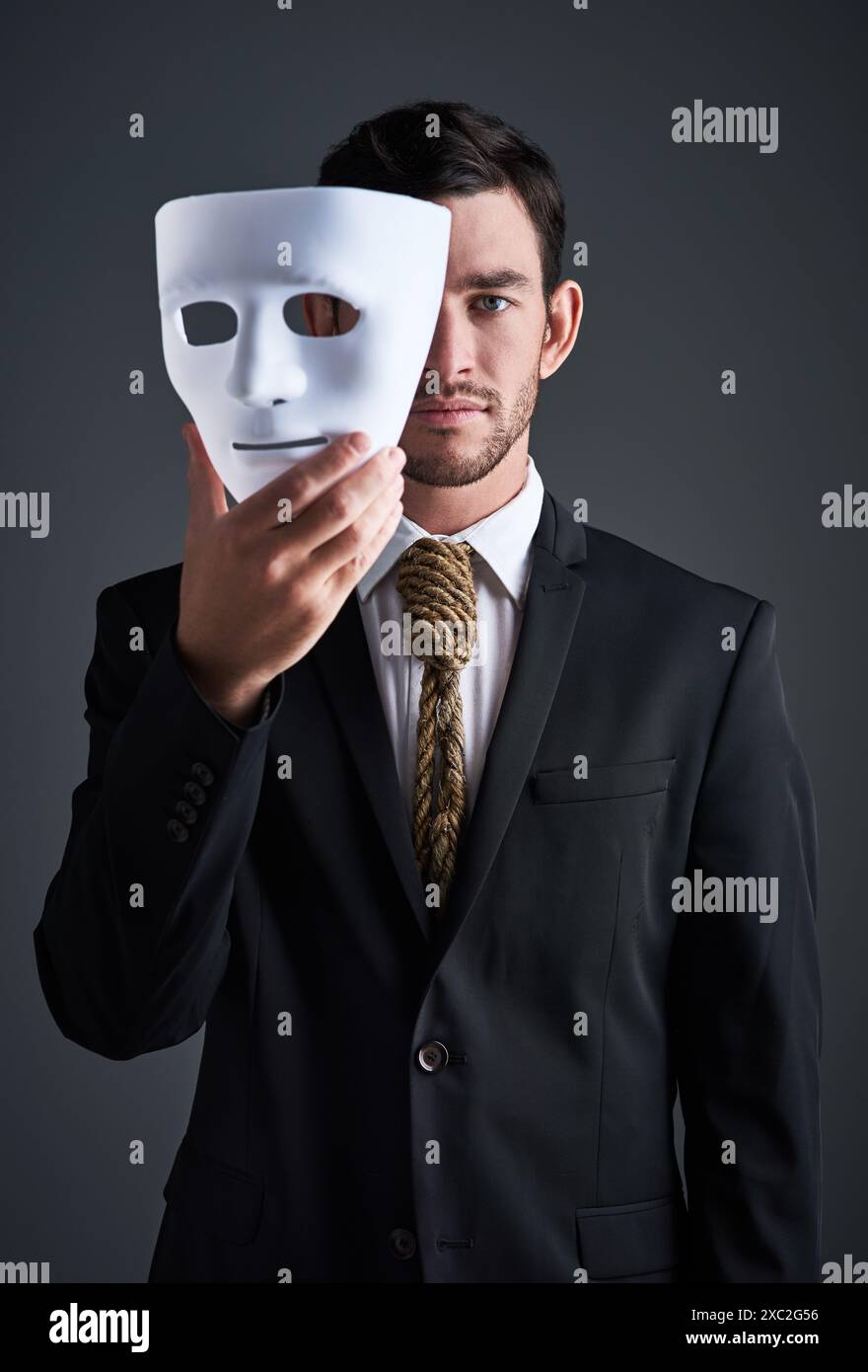 Portrait, business man and confidential mask of spy in studio isolated ...